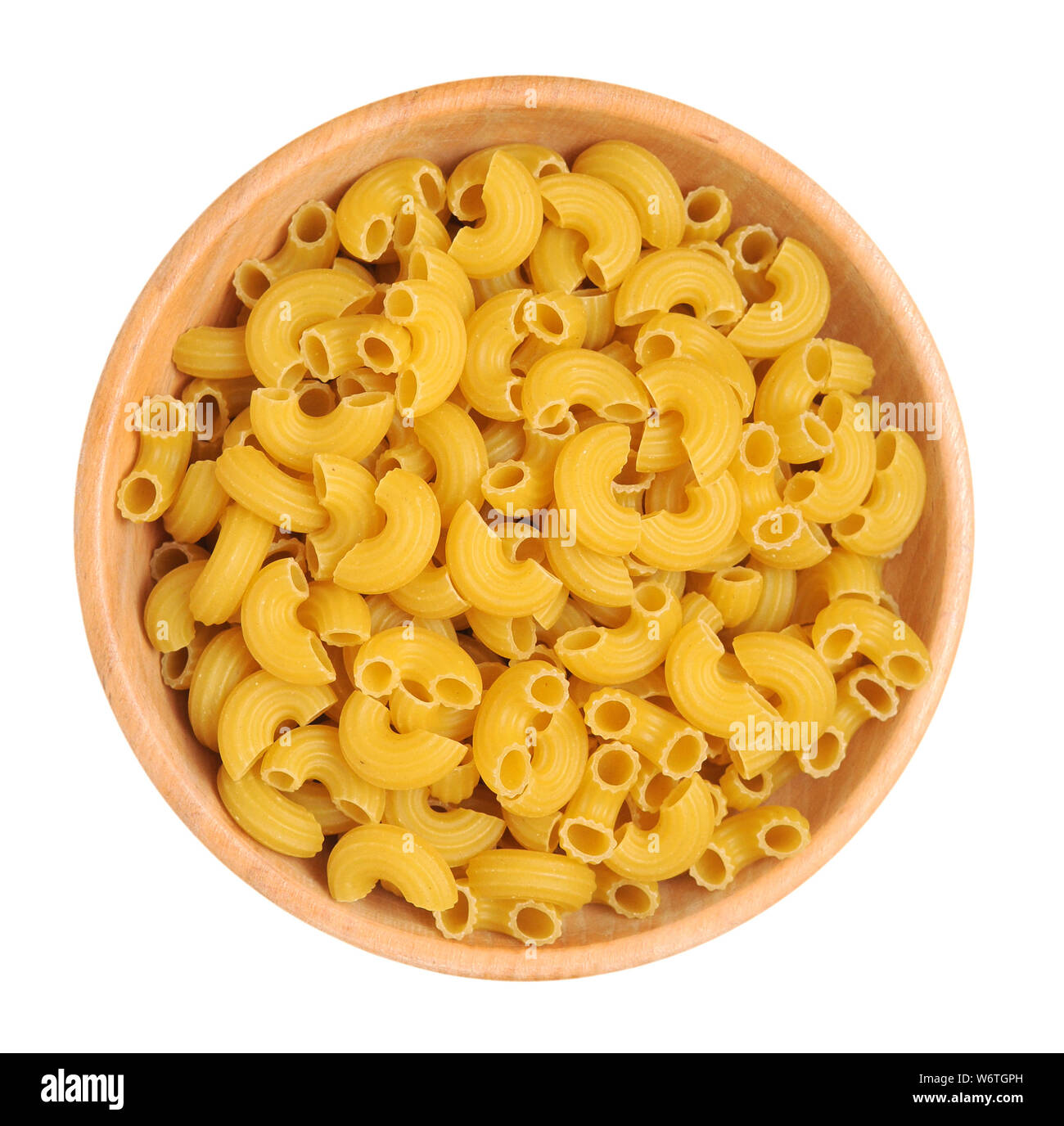 tube pasta in wooden bowl isolated on white background Stock Photo - Alamy