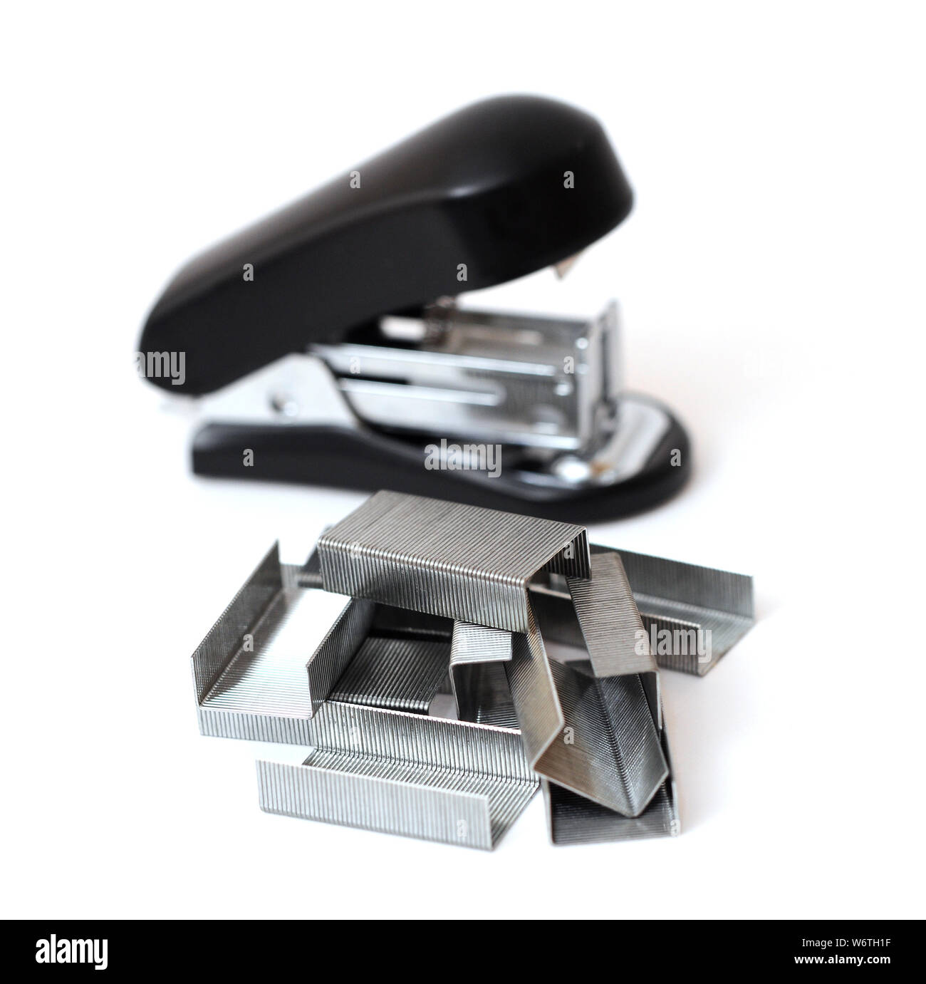 a lot of staple and stapler on white background Stock Photo - Alamy