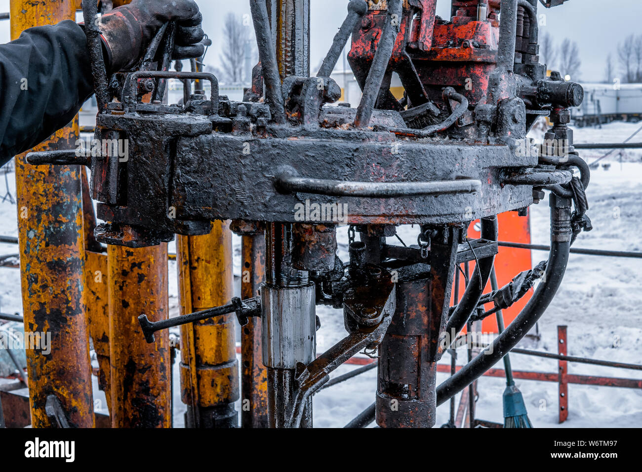 Workover rig working on a previously drilled well trying to restore ...