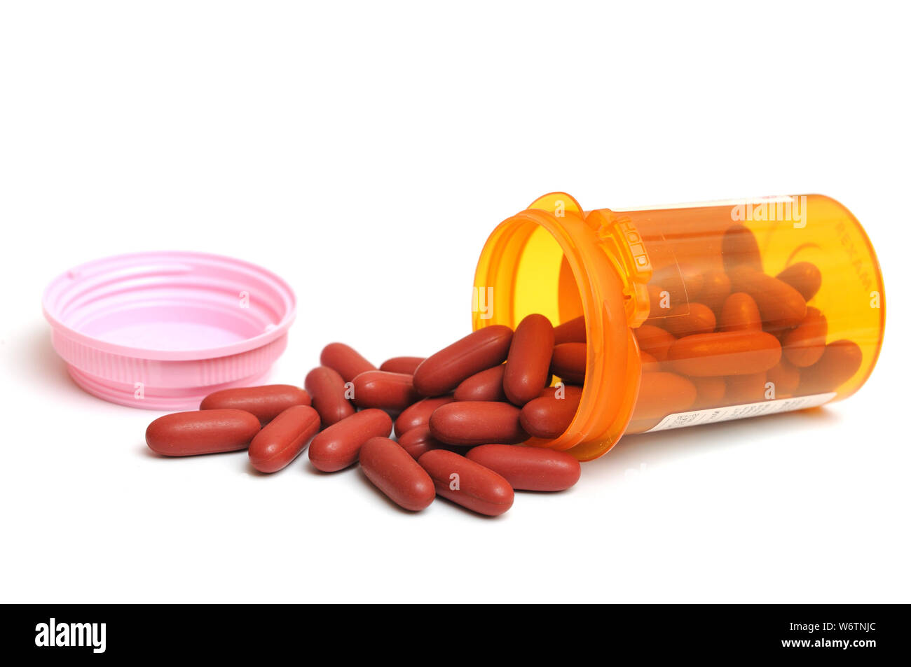many pills in plastic box on white Stock Photo - Alamy