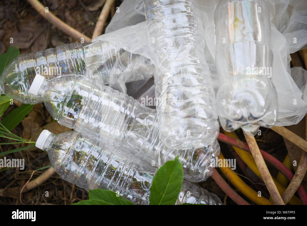 plastic bottle pollution environment / Recycle waste management concept ...