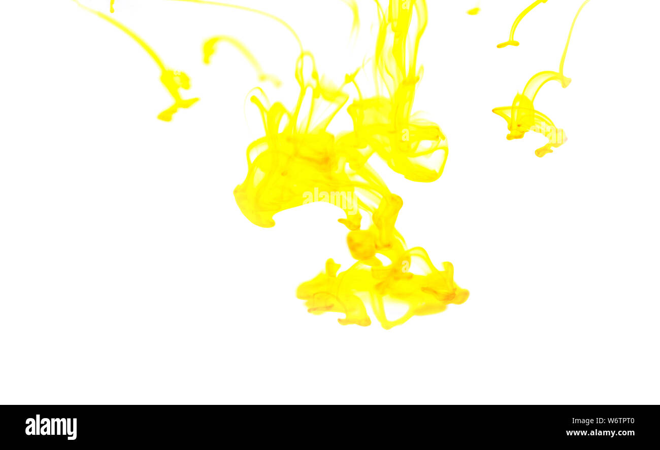 yellow ink drop Acrylic colors in water on white background , blur and ...