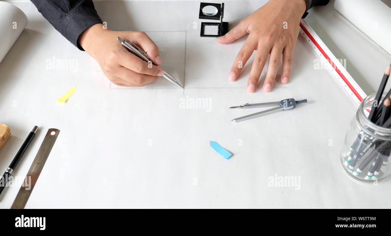 Architecture drawing on desk office. Top view shot Stock Photo - Alamy