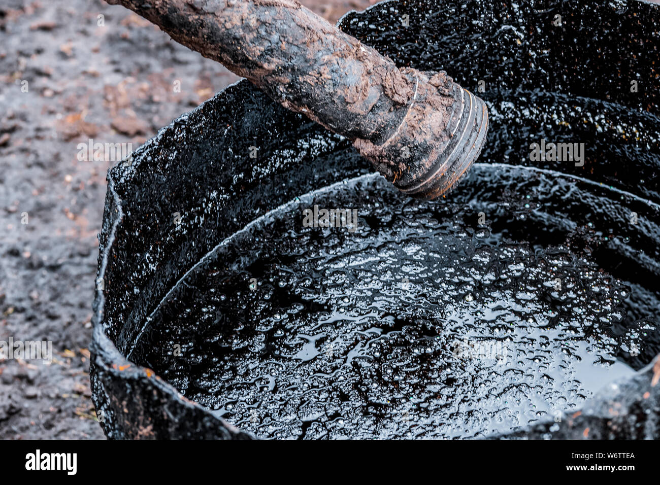 Dirty Oil spill on floor. Oil pollution Stock Photo - Alamy