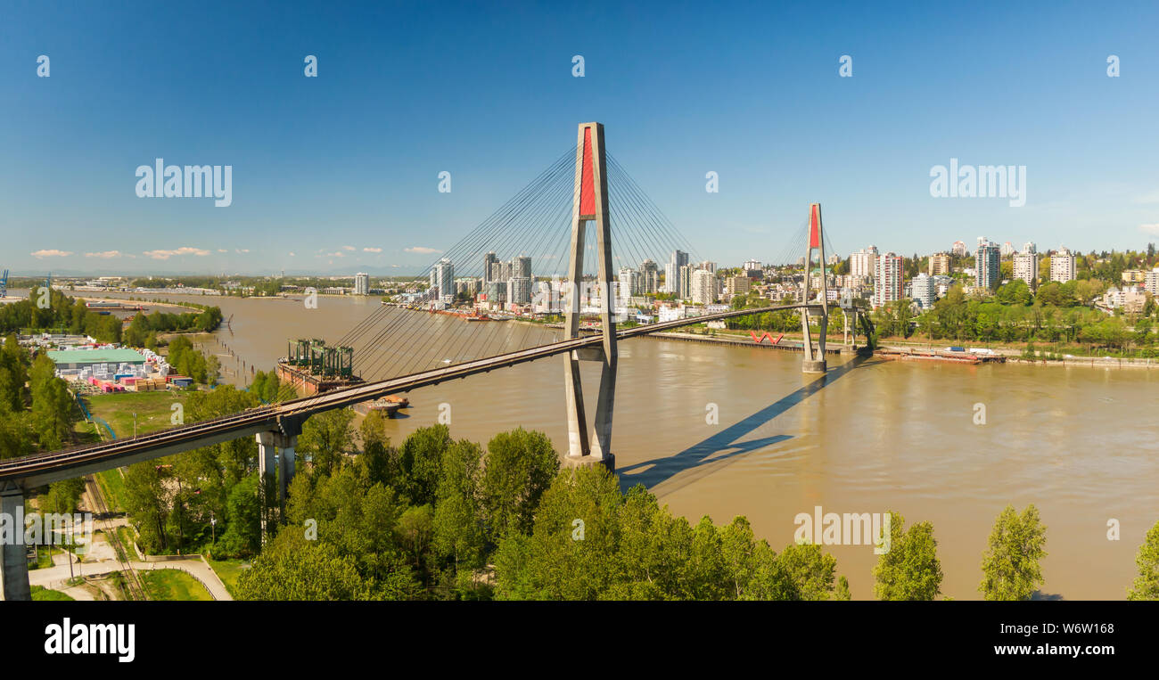Aerial panoramic view of Skytrain Bridge over the Fraser River. Taken ...