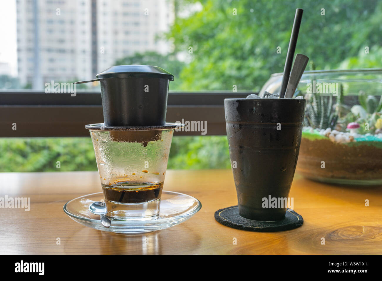 Dripping fin coffee with beautiful cityscape background in Vietnam ...