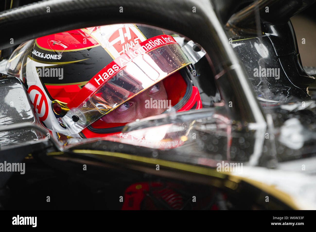 Haas F1 Team’s Danish driver Kevin Magnussen seats in his car during ...