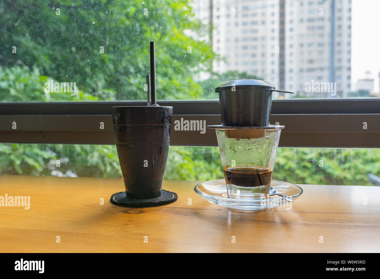 Close up photo of Vietnamese fin coffee with cityscape background Stock ...