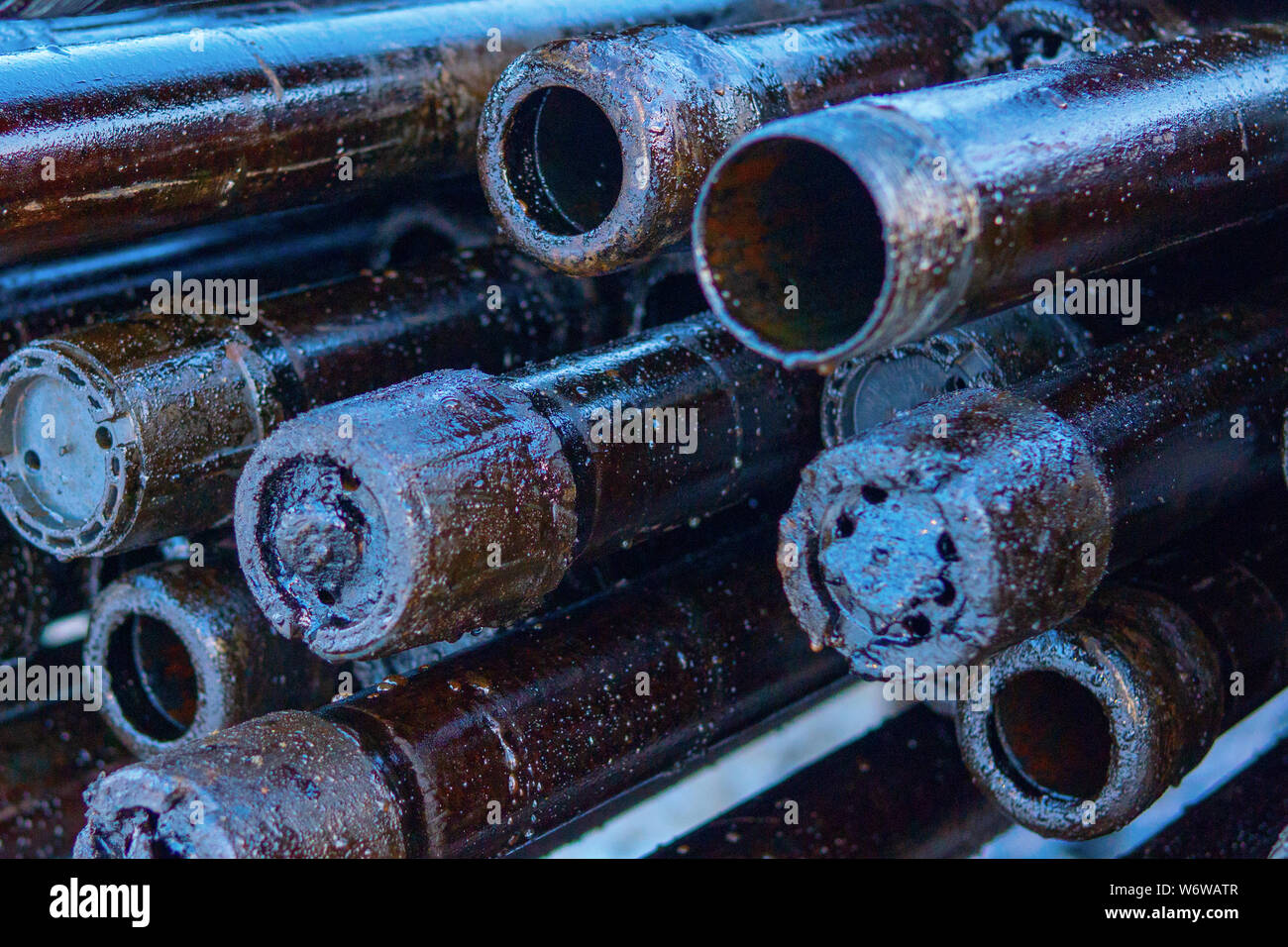Pipe metal texture. Drillpipe on Oil Rig Pipe Deck. Rusty drill pipes ...