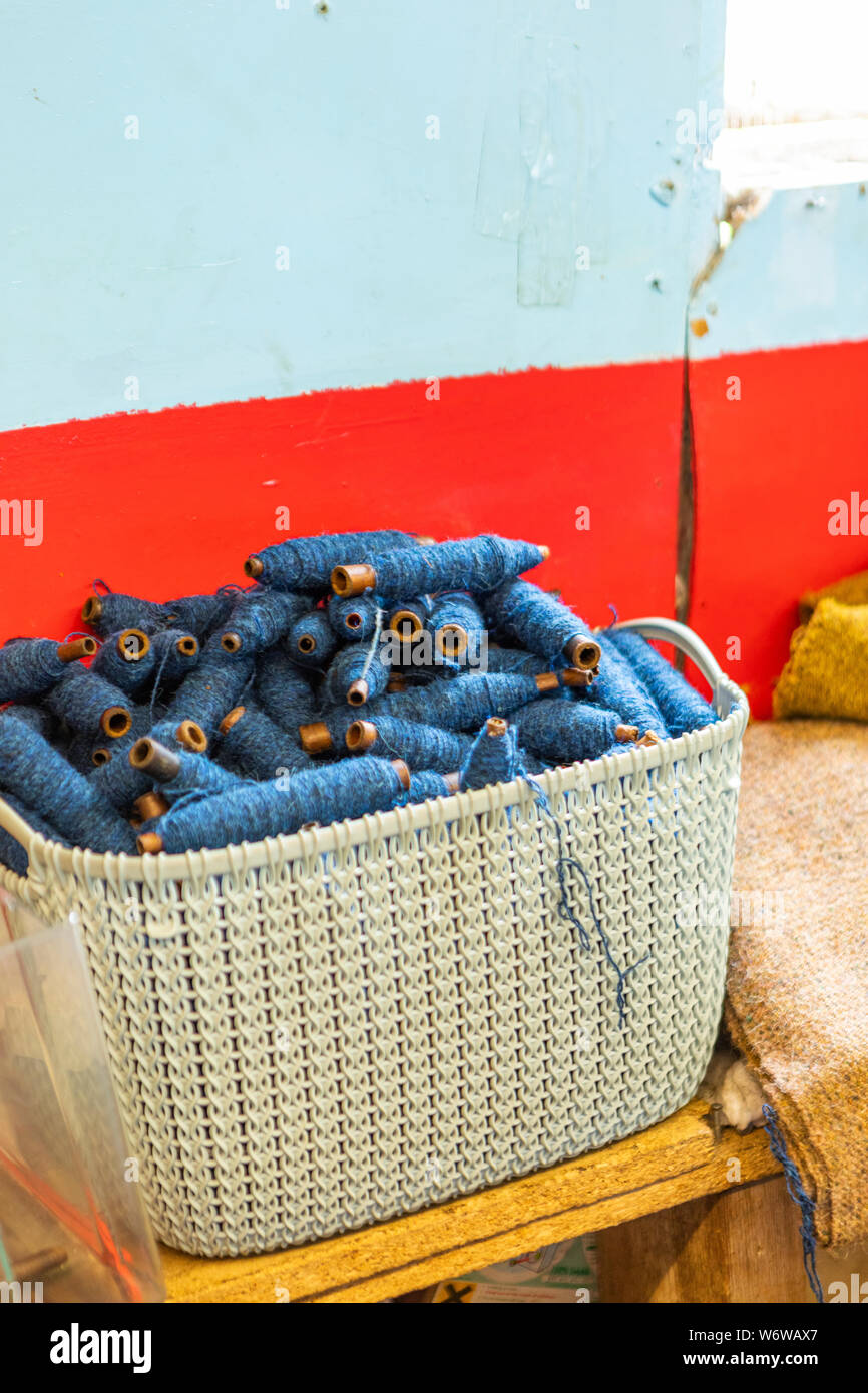 pile of blue woolen threads in a basket for weaving Tweed Stock Photo ...