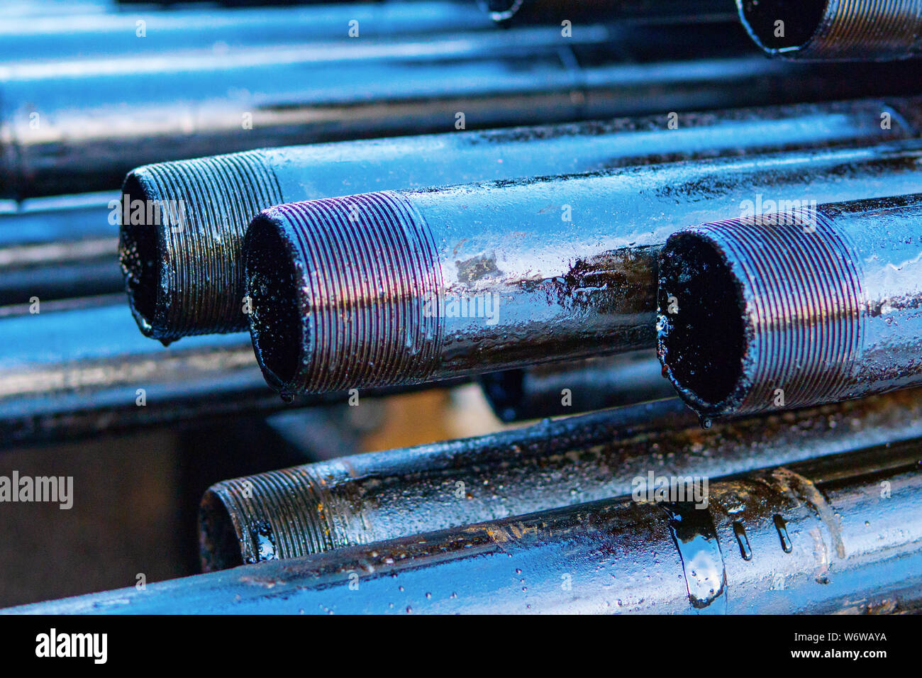 Pipe metal texture. Drillpipe on Oil Rig Pipe Deck. Rusty drill pipes ...