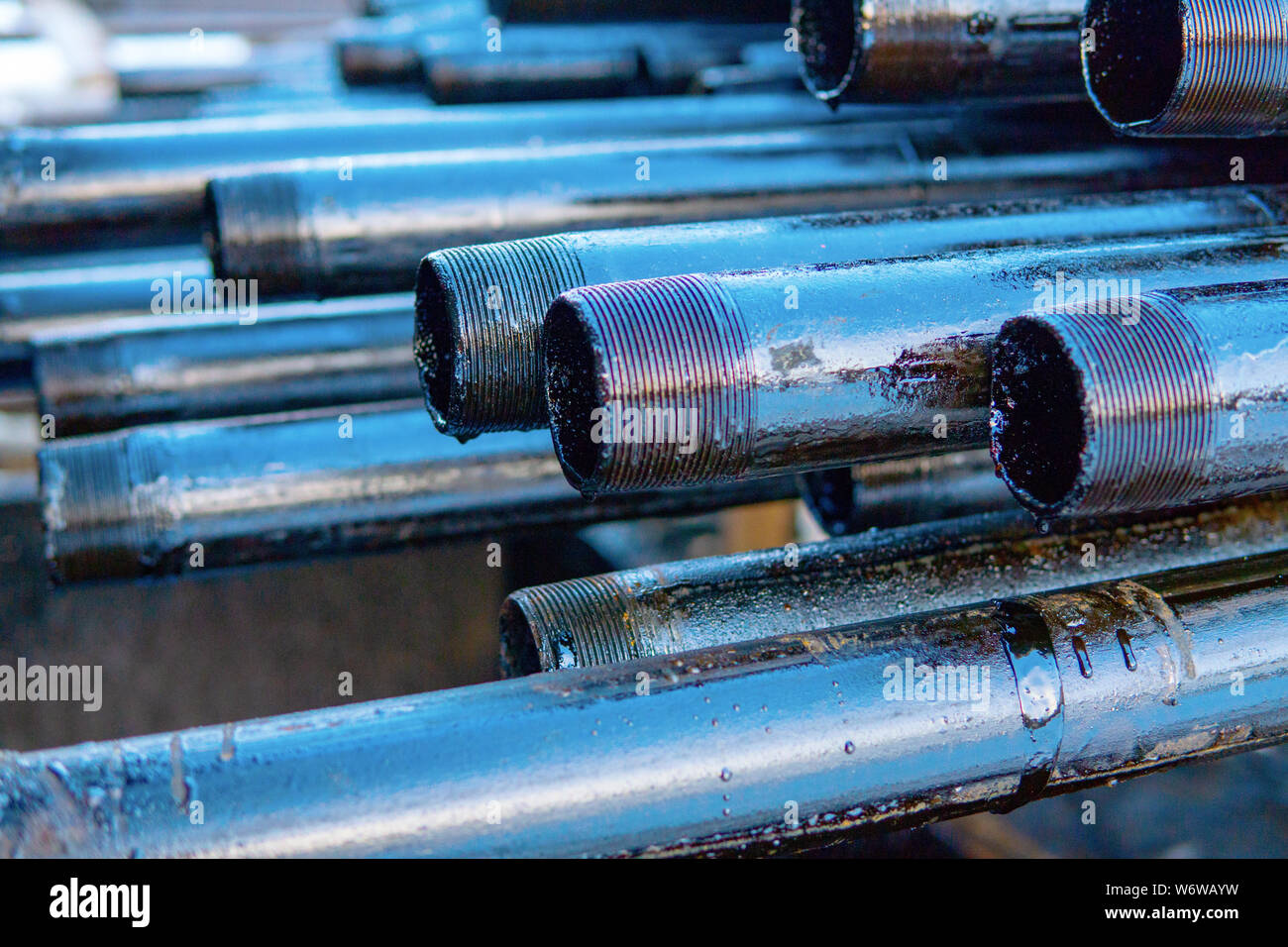 Pipe metal texture. Drillpipe on Oil Rig Pipe Deck. Rusty drill pipes ...