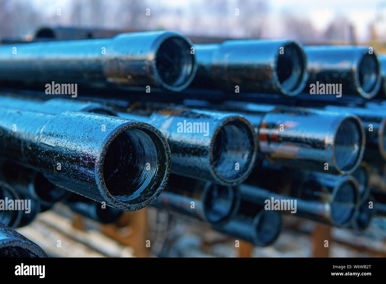 Pipe metal texture. Drillpipe on Oil Rig Pipe Deck. Rusty drill pipes ...