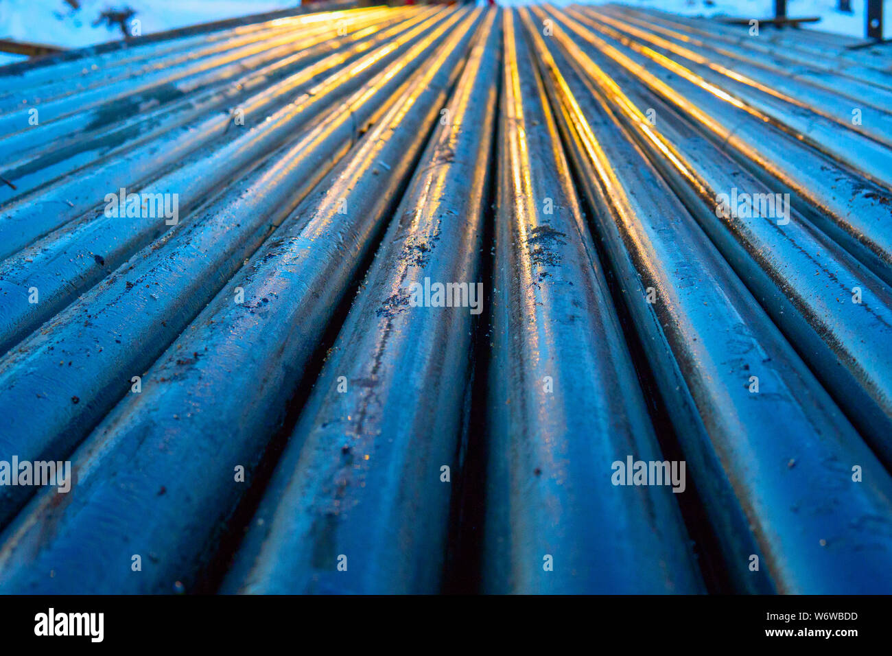 Pipe metal texture. Drillpipe on Oil Rig Pipe Deck. Rusty drill pipes ...