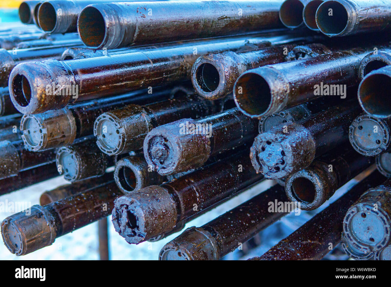 Pipe metal texture. Drillpipe on Oil Rig Pipe Deck. Rusty drill pipes ...
