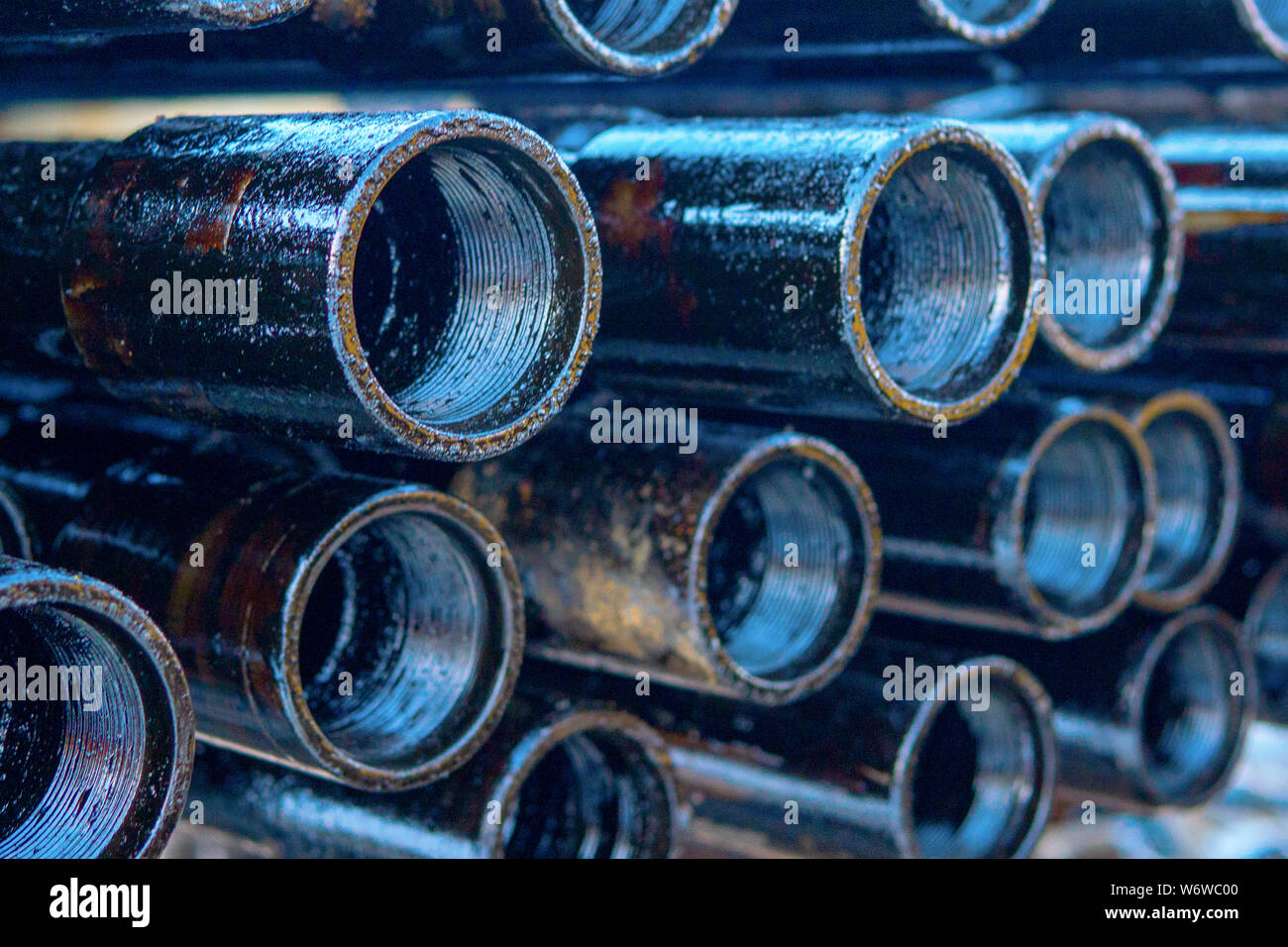 Pipe metal texture. Drillpipe on Oil Rig Pipe Deck. Rusty drill pipes ...