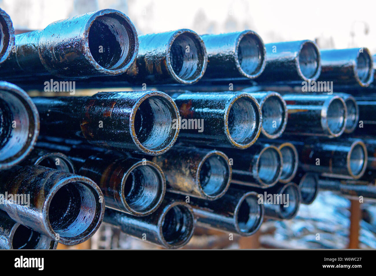 Pipe metal texture. Drillpipe on Oil Rig Pipe Deck. Rusty drill pipes ...