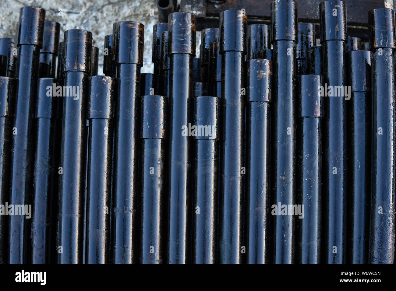 Pipe metal texture. Drillpipe on Oil Rig Pipe Deck. Rusty drill pipes ...