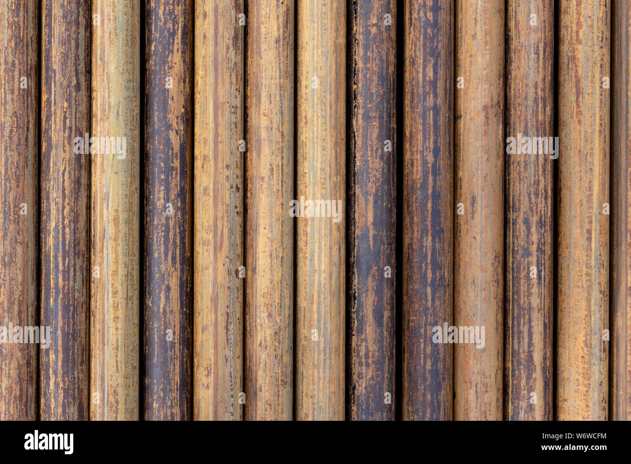 Rusty grunge pipes horizontal background. Orange corrosion rust on ...