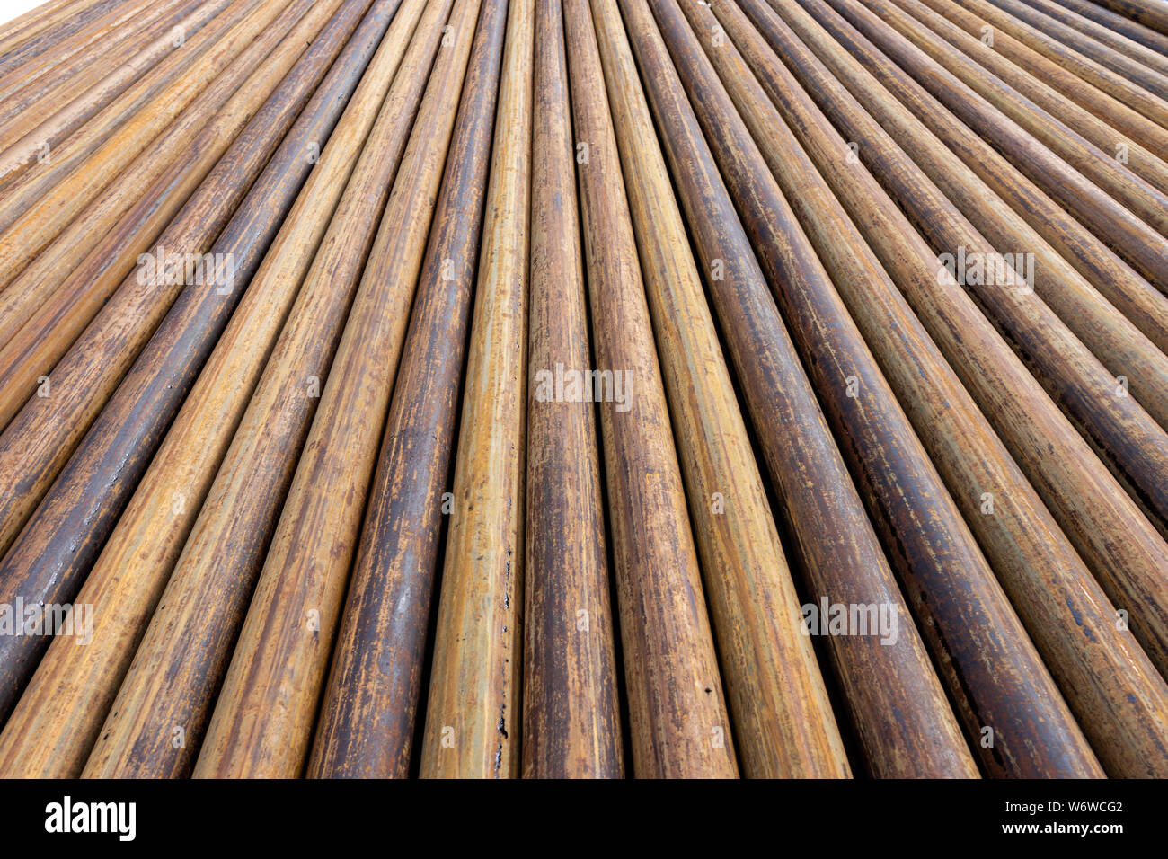 Rusty grunge pipes horizontal background. Orange corrosion rust on ...