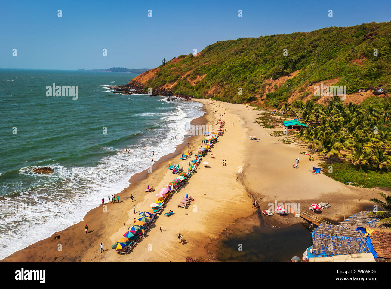 top view of beach in Goa India vagator beach. people taking sunbath on ...