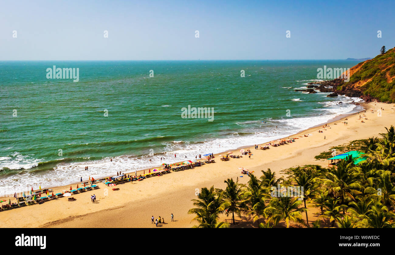 top view of beach in Goa India vagator beach. people taking sunbath on ...