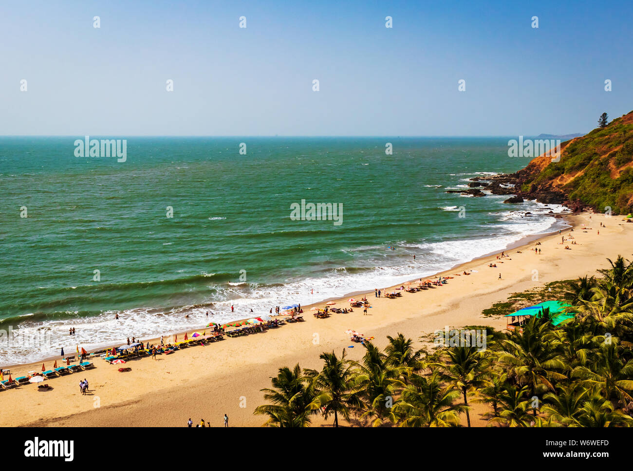 top view of beach in Goa India vagator beach. people taking sunbath on ...