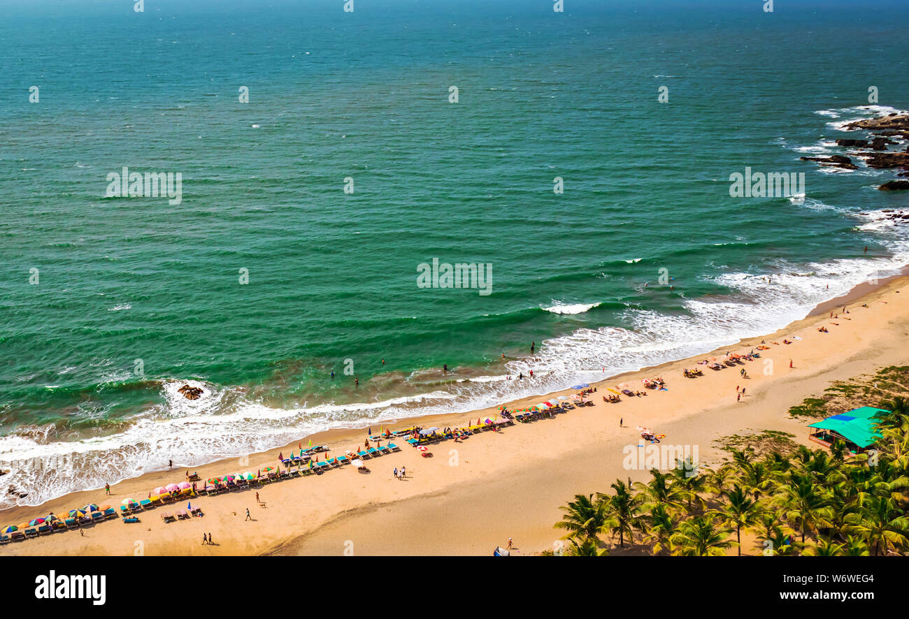 top view of beach in Goa India vagator beach. people taking sunbath on ...