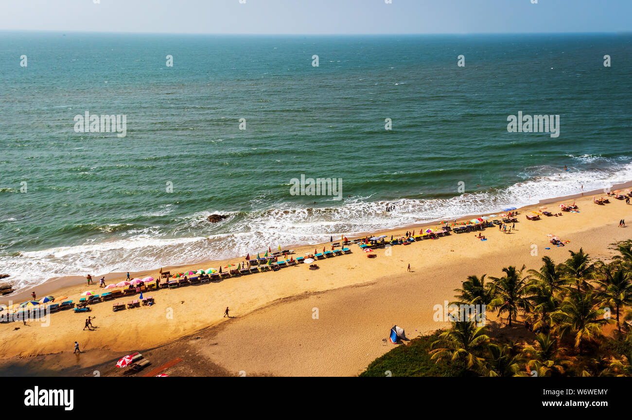 top view of beach in Goa India vagator beach. people taking sunbath on ...