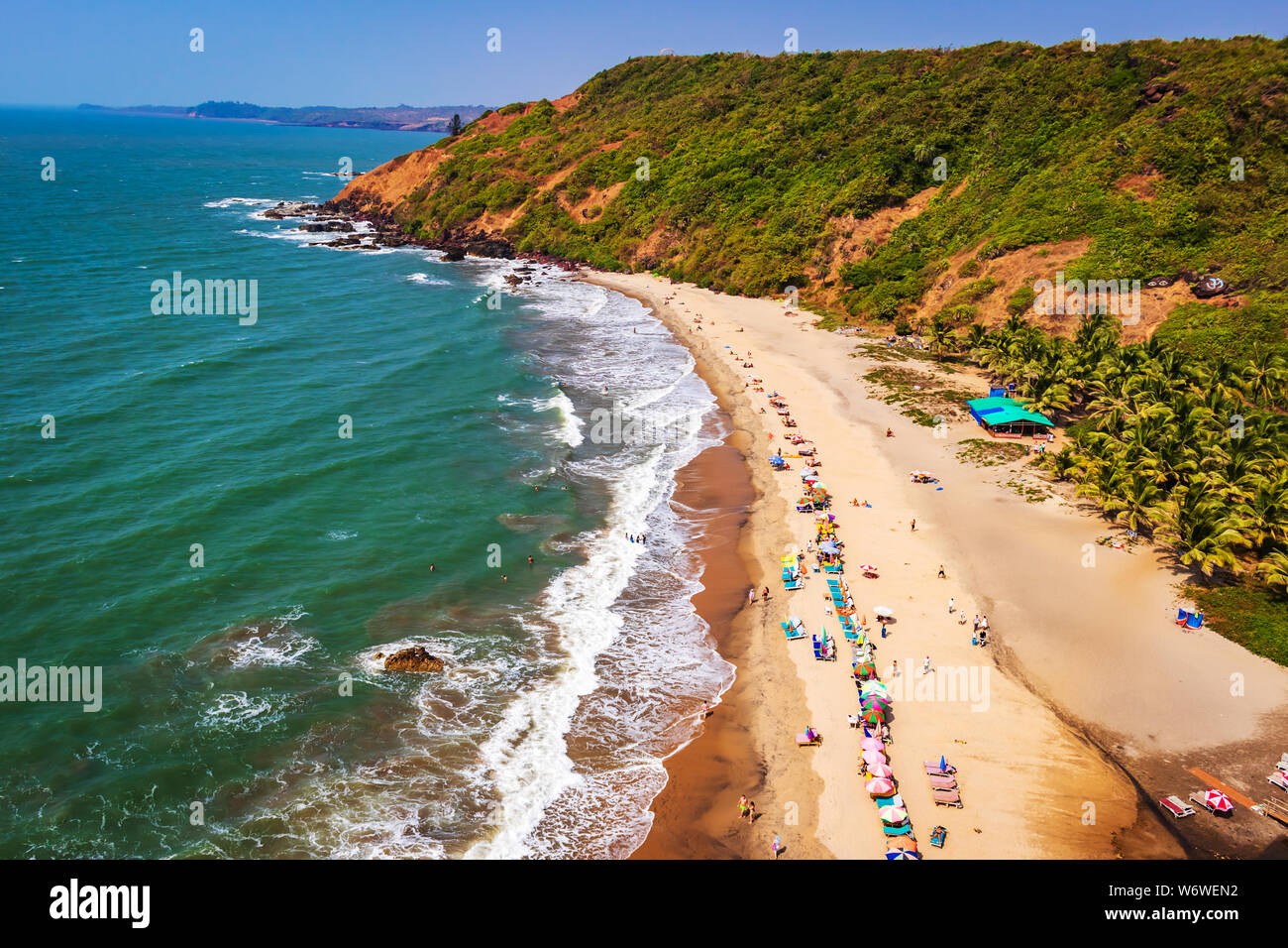 top view of beach in Goa India vagator beach. people taking sunbath on ...