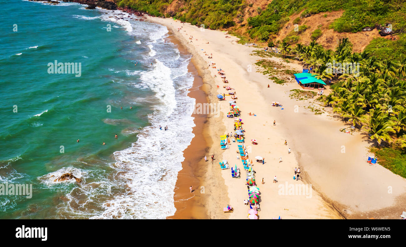 top view of beach in Goa India vagator beach. people taking sunbath on ...