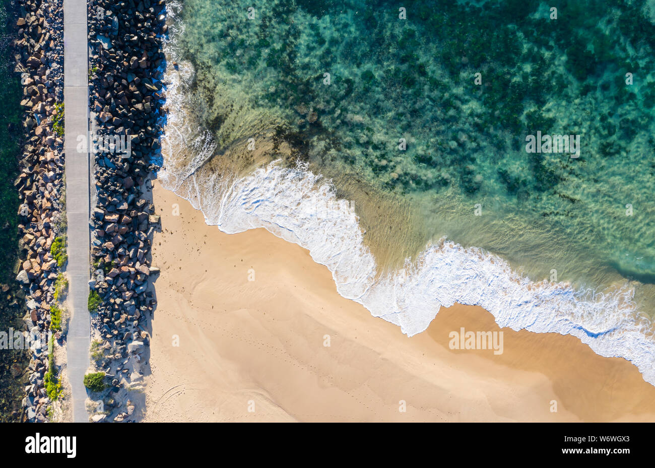Aerial view of Nobbys Beach - Newcastle NSW Australia showing breakwall ...