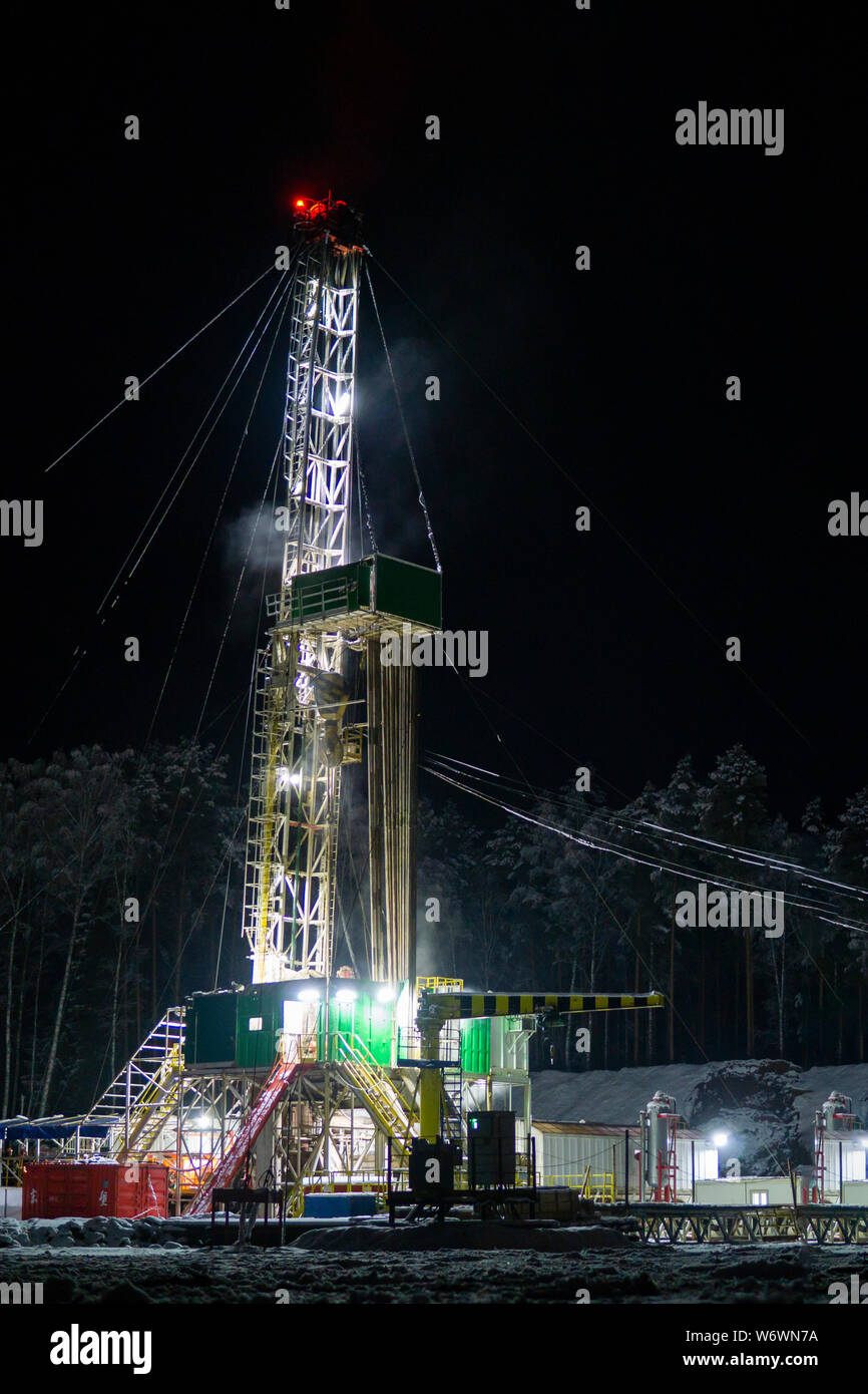Oil and Gas Drilling Rig onshore dessert with dramatic cloudscape. Oil ...