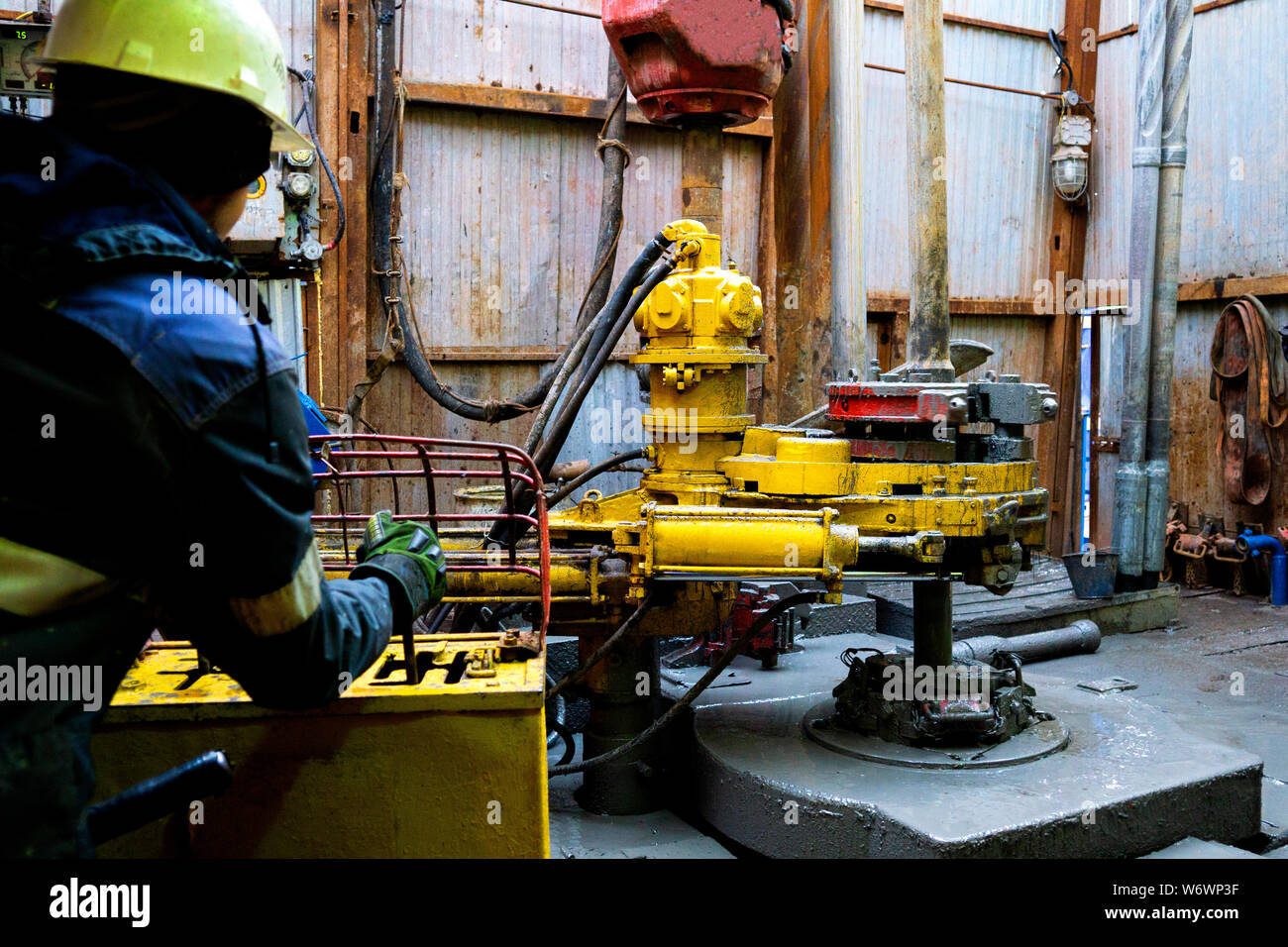 Onshore oil rig worker prepare tool and equipment for perforation oil ...