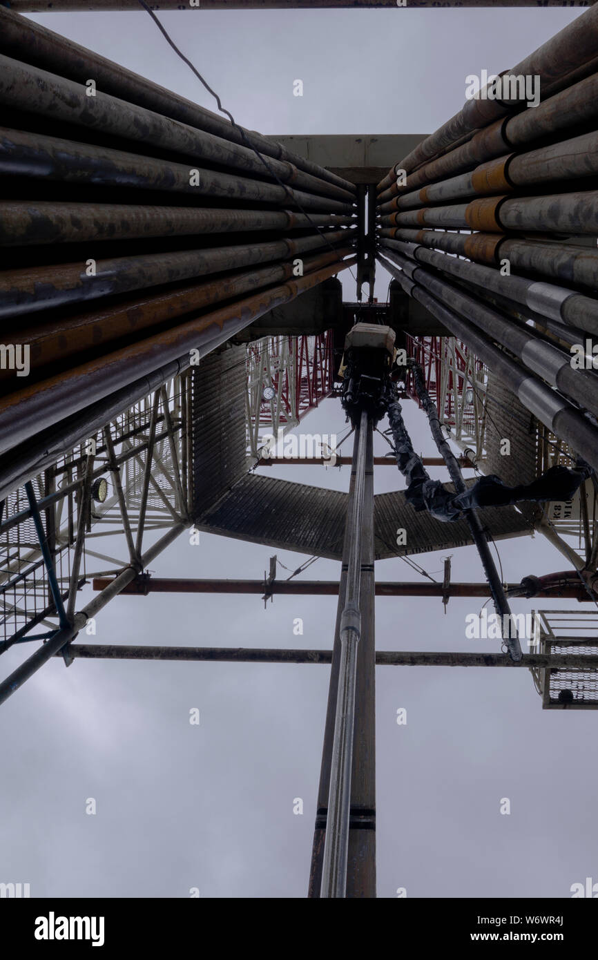 Oil and Gas Drilling Rig onshore dessert with dramatic cloudscape. Oil ...