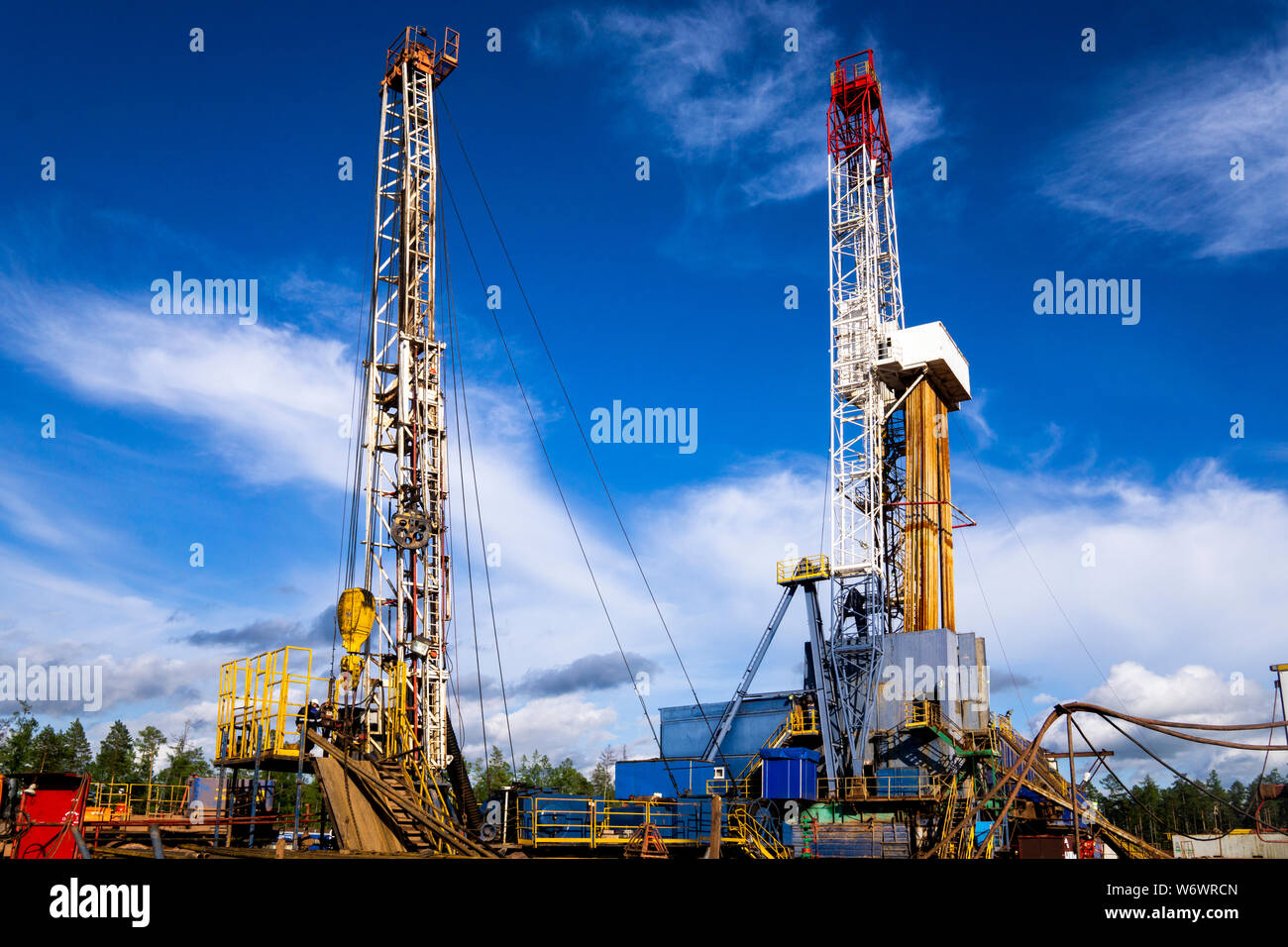Oil and Gas Drilling Rig onshore dessert with dramatic cloudscape. Oil ...