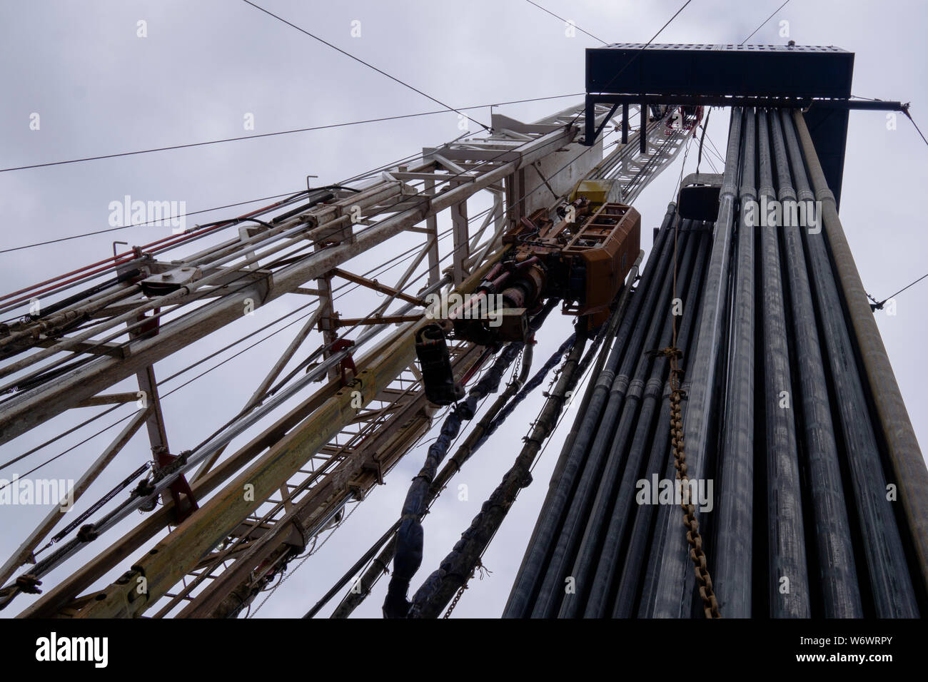 Oil and Gas Drilling Rig onshore dessert with dramatic cloudscape. Oil ...