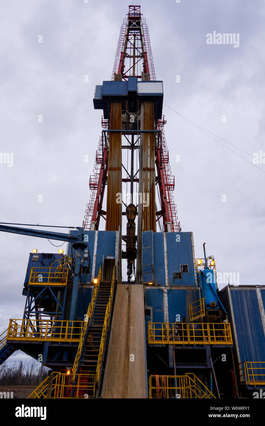 Oil and Gas Drilling Rig onshore dessert with dramatic cloudscape. Oil ...