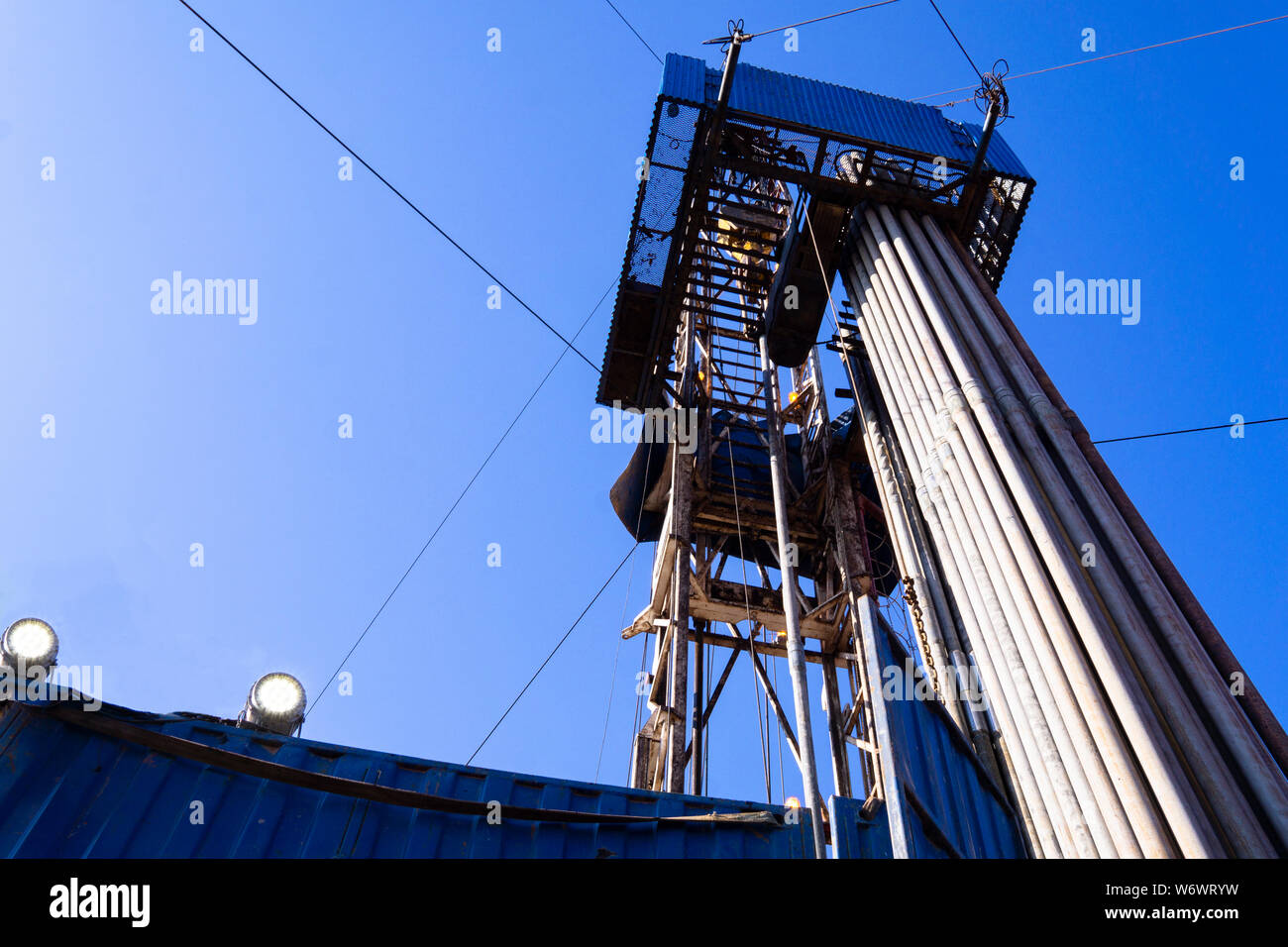 Oil and Gas Drilling Rig onshore dessert with dramatic cloudscape. Oil ...