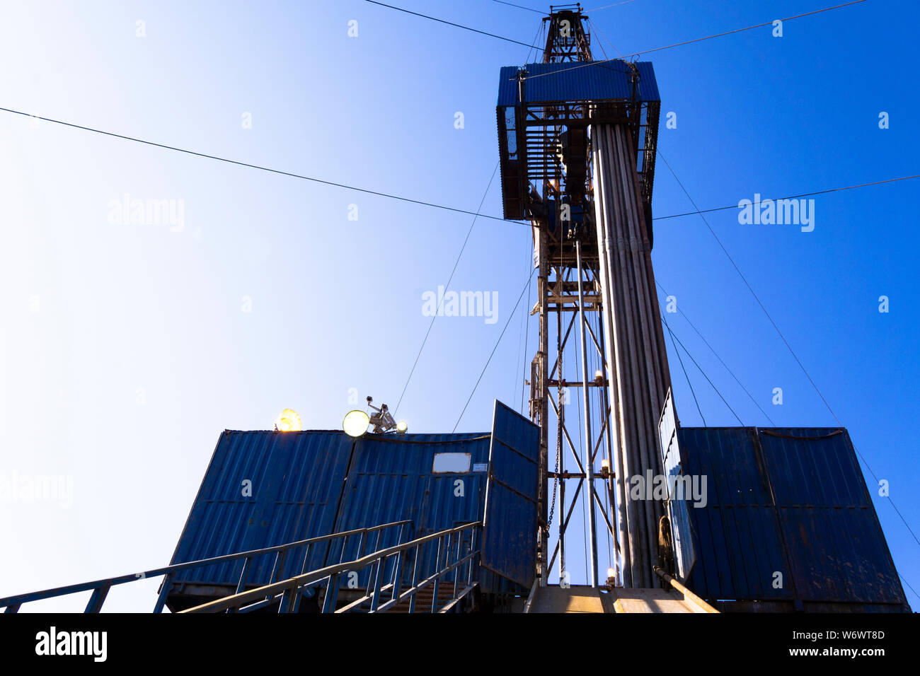 Oil and Gas Drilling Rig onshore dessert with dramatic cloudscape. Oil ...