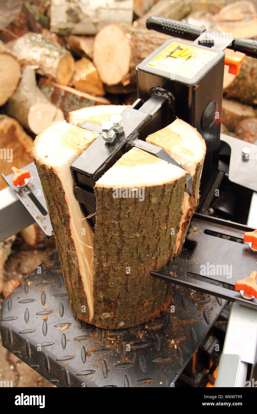 wood splitters with firewood Stock Photo - Alamy