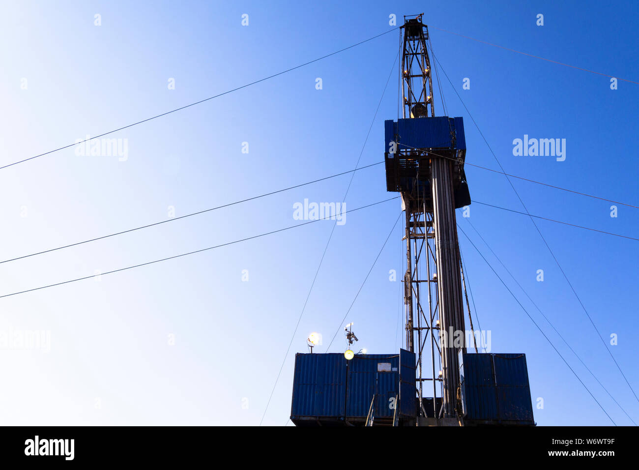 Oil and Gas Drilling Rig onshore dessert with dramatic cloudscape. Oil ...