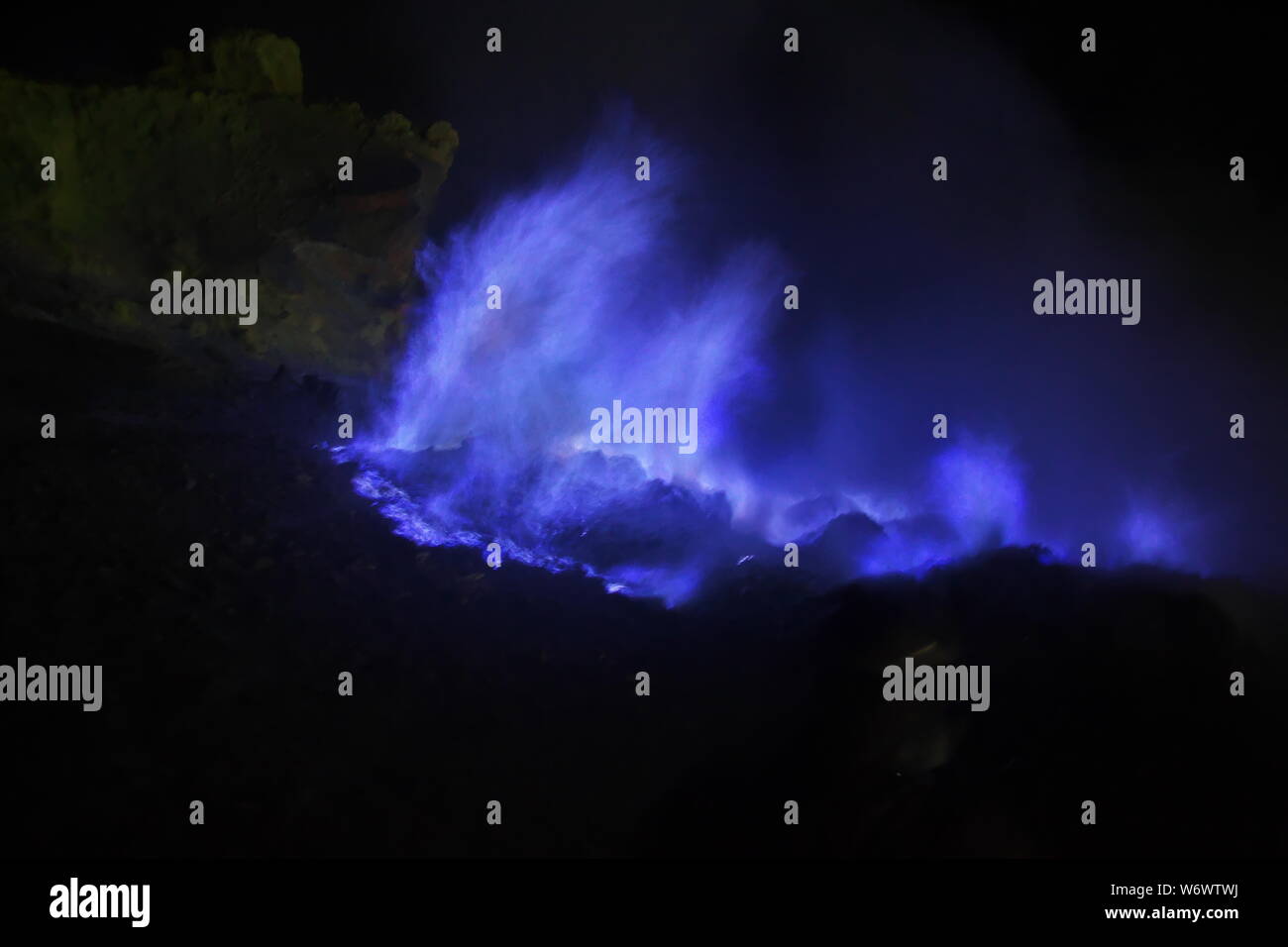 The blue fire in fog at night on Ijen volcano, Indonesia Stock Photo ...