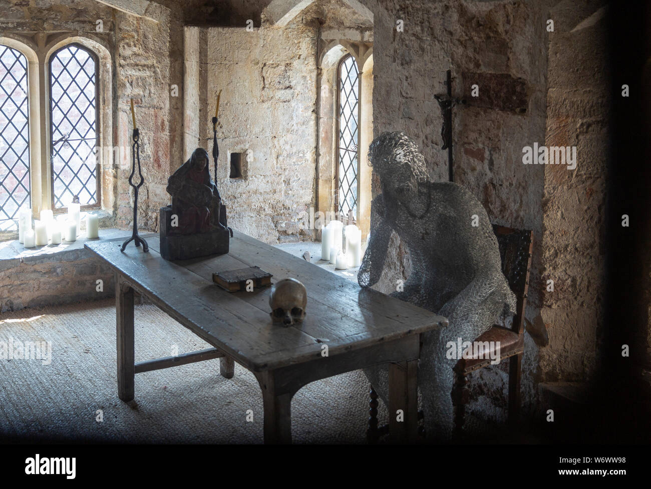 Wire art sculpture figure of King Edward the second in prison cell room ...