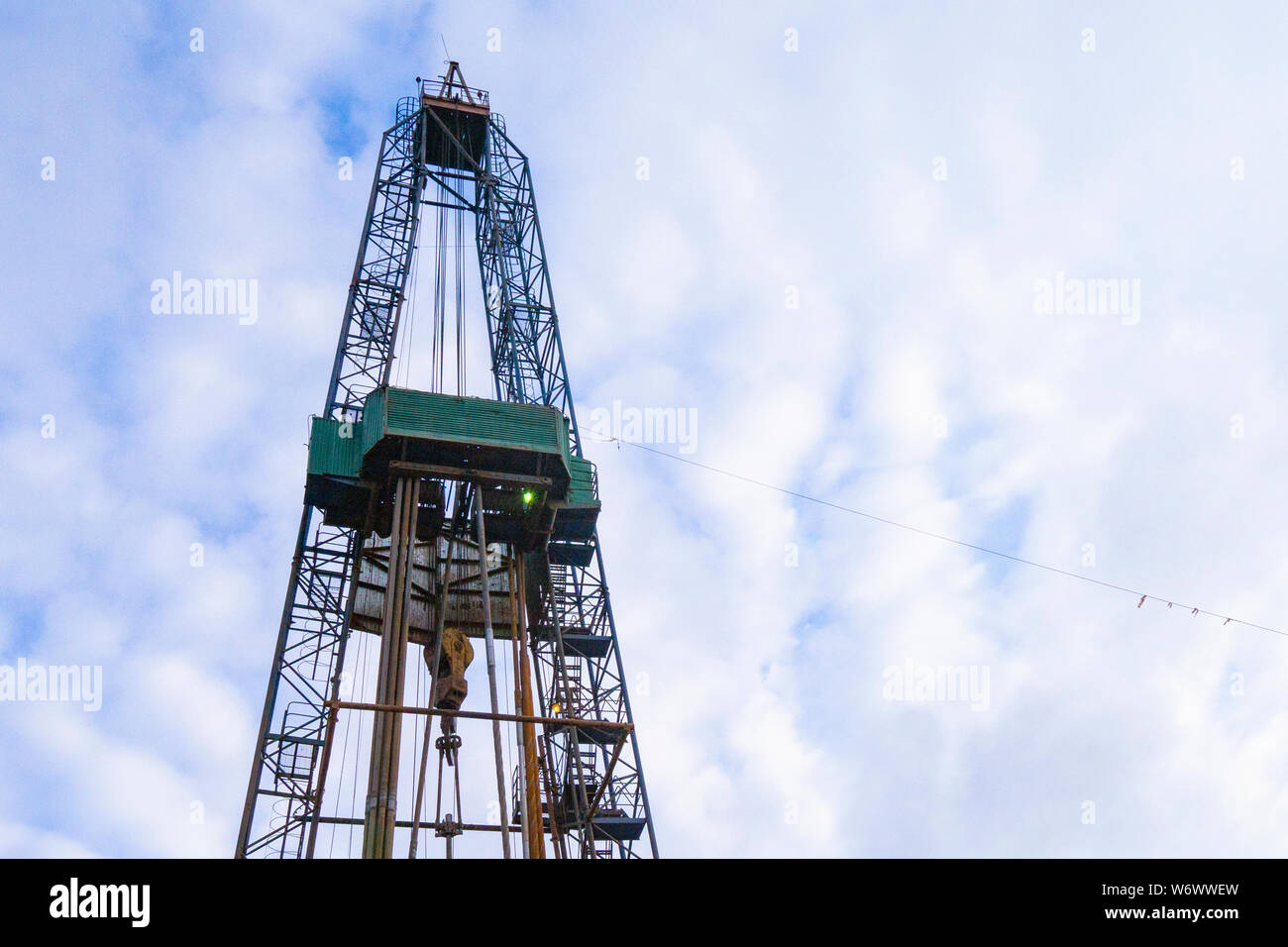 Oil and Gas Drilling Rig onshore dessert with dramatic cloudscape. Oil ...