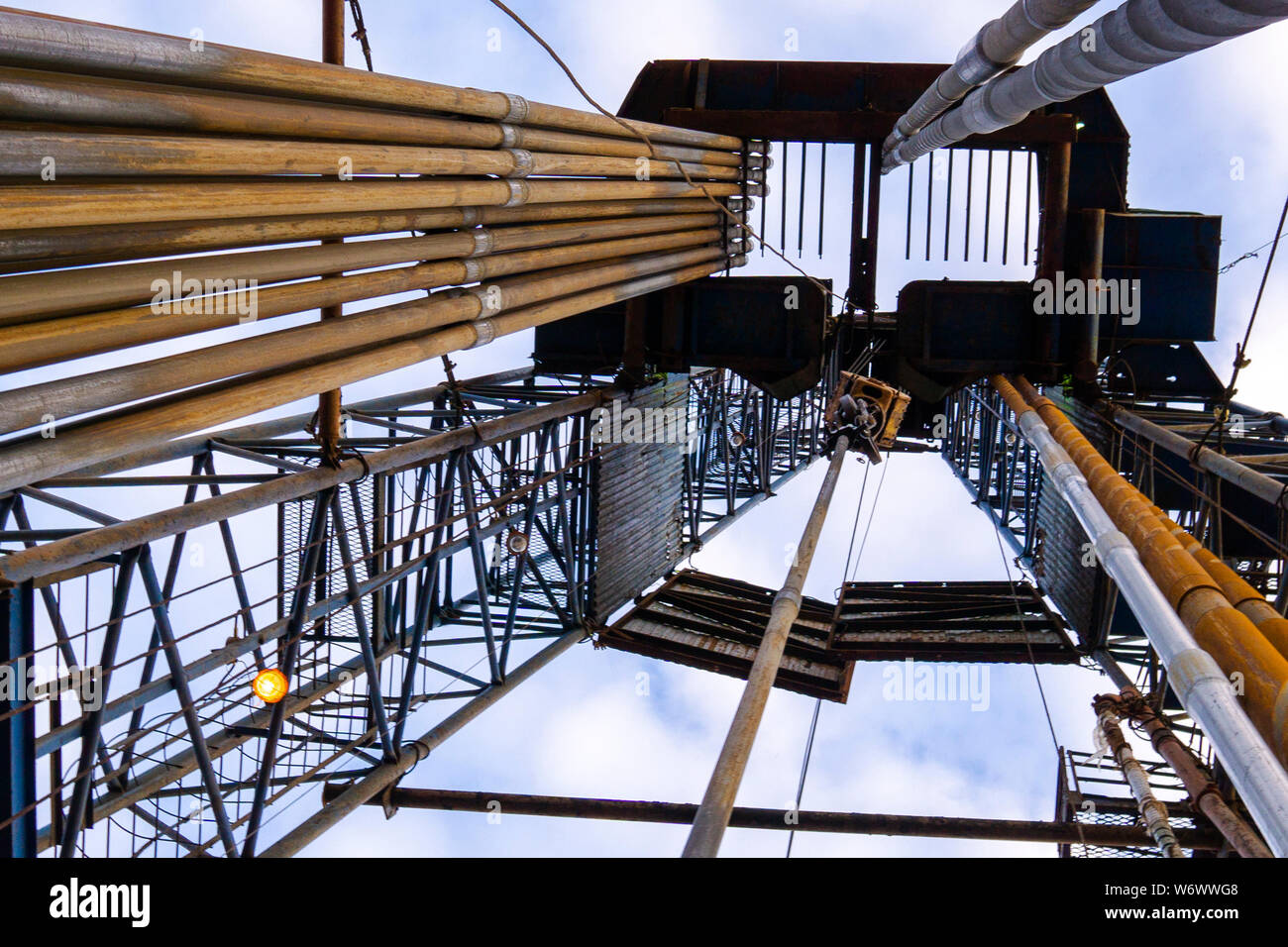 Oil and Gas Drilling Rig onshore dessert with dramatic cloudscape. Oil ...