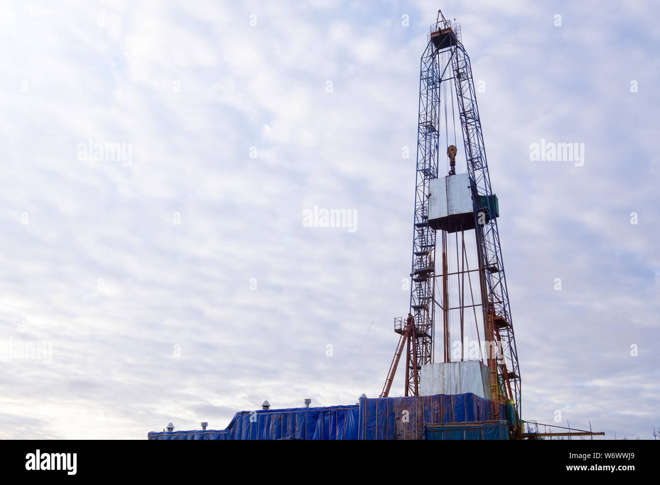 Oil and Gas Drilling Rig onshore dessert with dramatic cloudscape. Oil ...