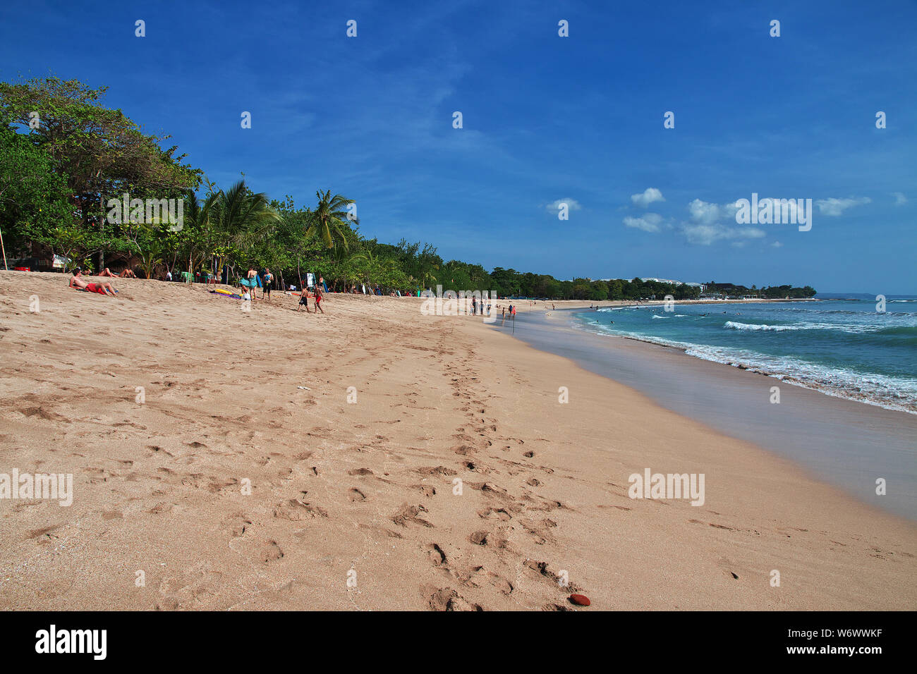 Kuta beach scene with tourists hi-res stock photography and images - Alamy