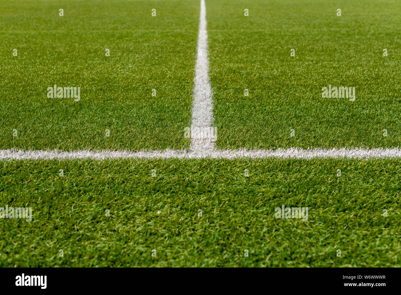 Texture of artificial grass herb cover sports field. It is used in ...