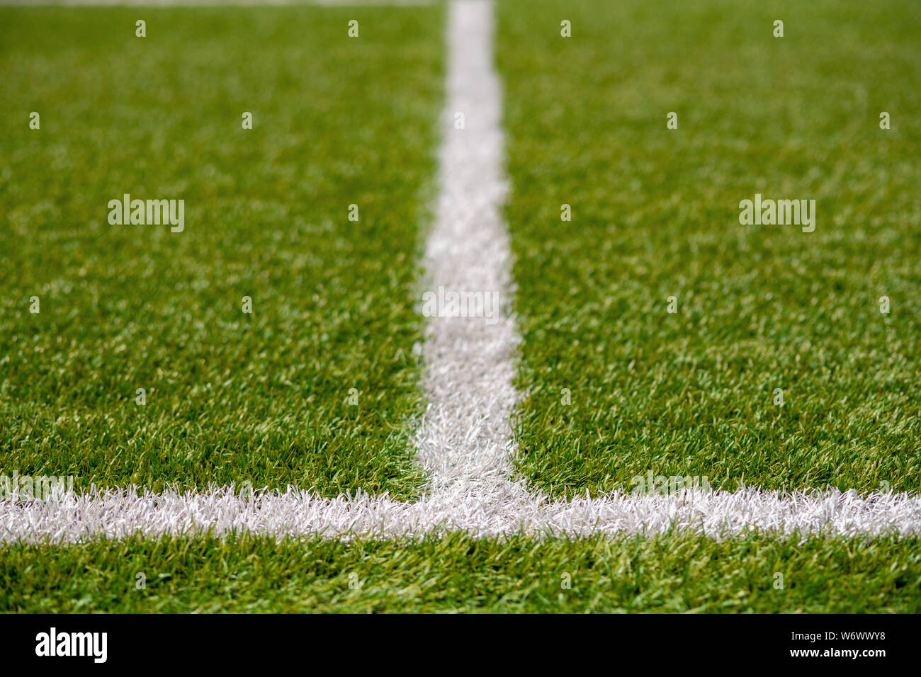 Texture of artificial grass herb cover sports field. It is used in ...